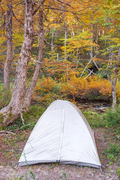 Grey silver tent in a remote wild campsite in the mountains with copy ...