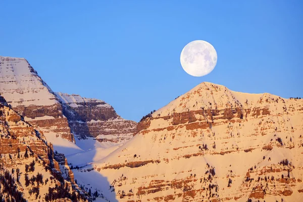 March Sunrise with a full moon in the Wasatch mountains, Utah, USA ...