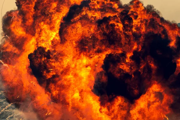 Massive orange fire explosion in military combat and war. Vehicle ...