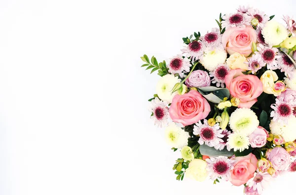 The composition of flowers in the box is photographed from above. The ...