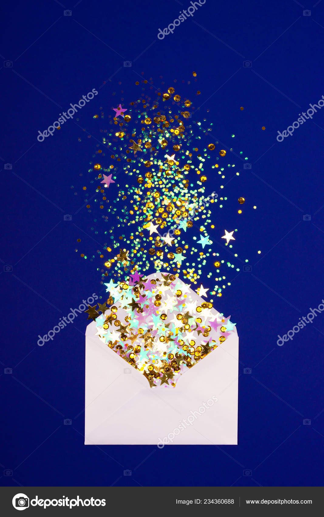 Colorful confetti scattered from envelope on blue background. Stock ...