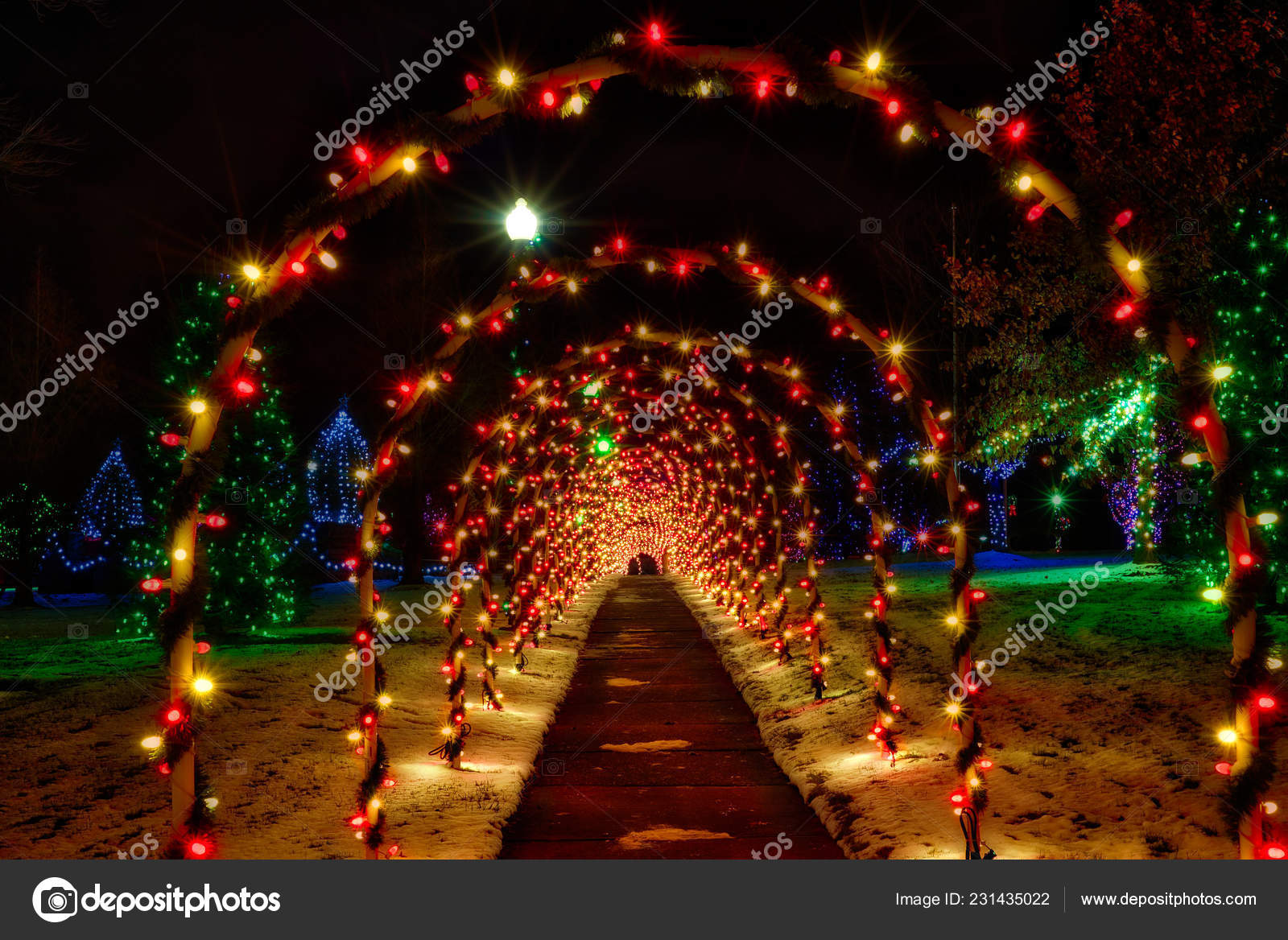 Festive Tunnel Lighted Arches Village Square Christmas Setting Stock ...