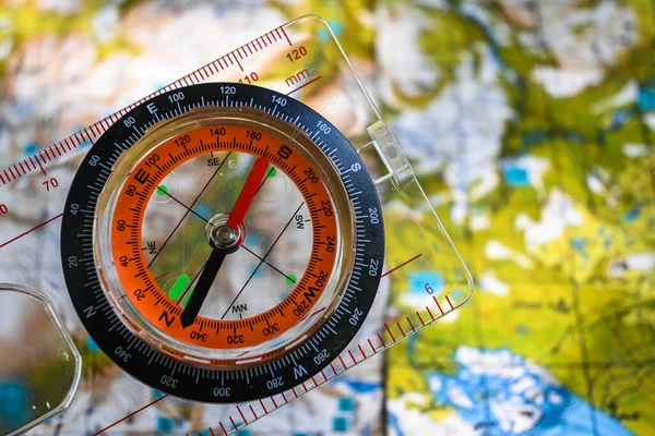 Orientation by map and compass. Symbols of expedition and travel in the ...