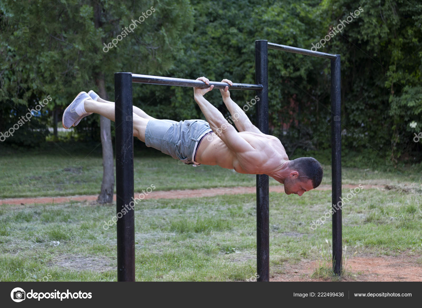 Young Muscular Young Man Doing Exercises Parallel Bars — Stock Photo ...