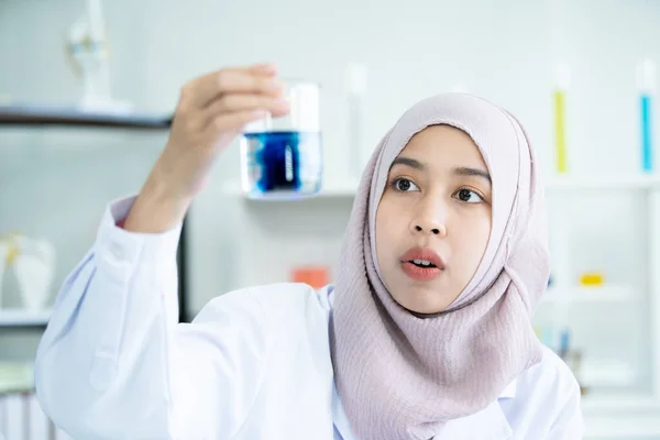 Smiling Female Muslim Scientists Experimenting Microscope Dry Ice ...