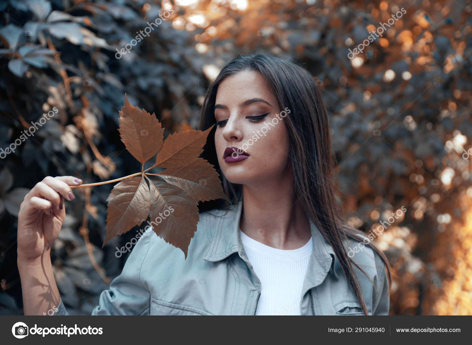 Young Beautiful Woman Posing Leaf Stock Photo by ©Sashka.photo 291045940