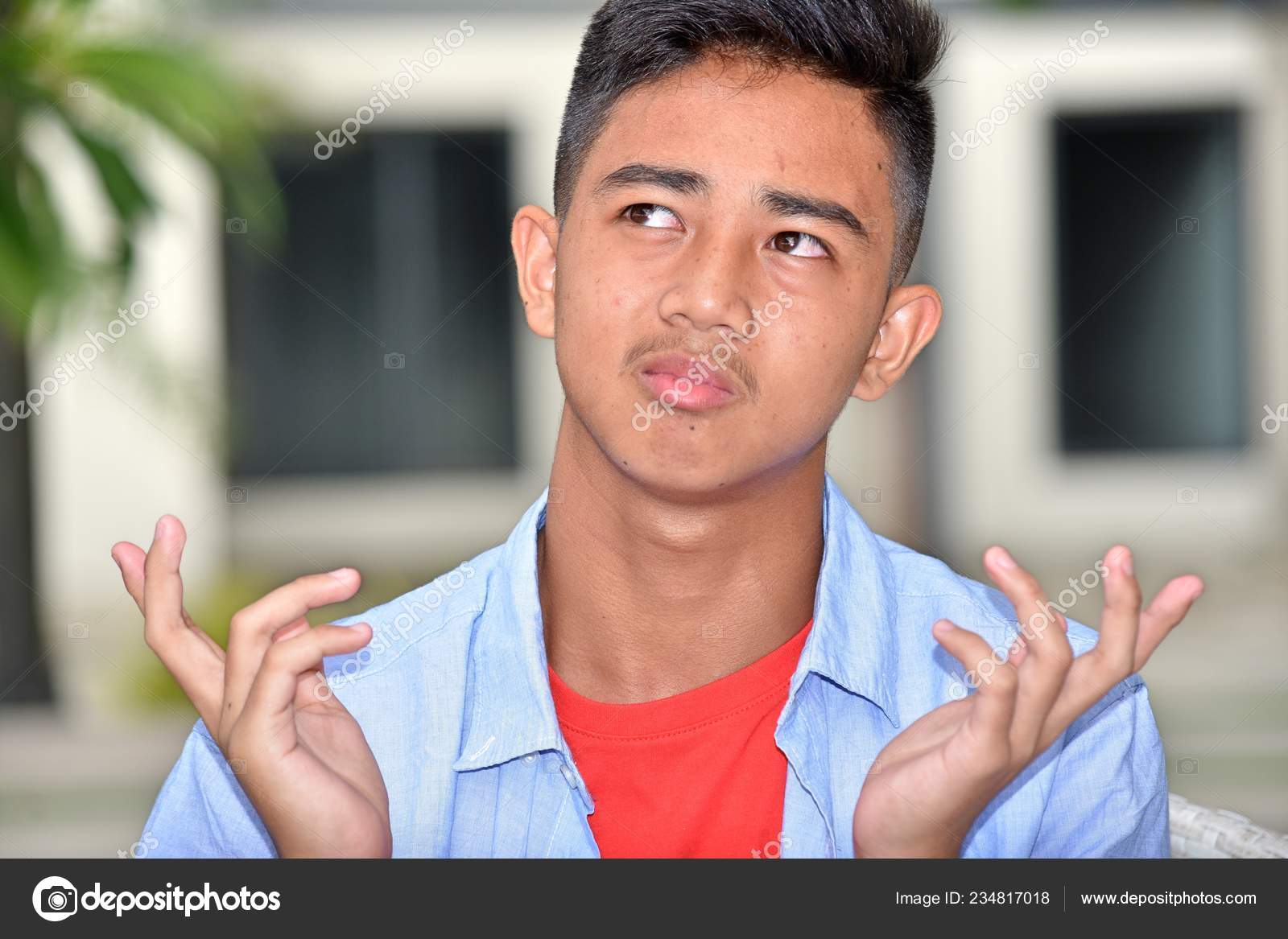 Confused Good Looking Minority Youth — Stock Photo © dtiberio #234817018