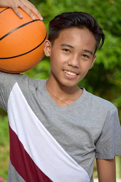 Youth Male Basketball Player Smiling With Basketball - Stock Image ...