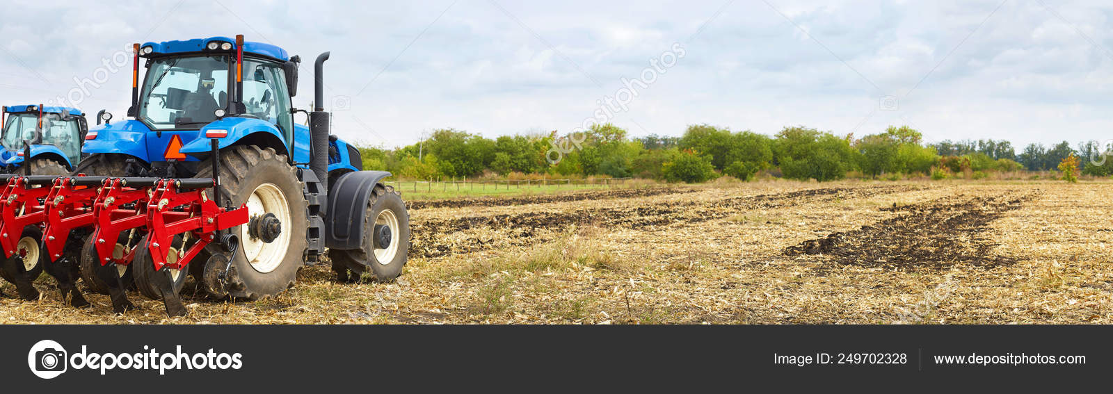 Several powerful tractors work in the field. — Stock Photo © Veremeev ...