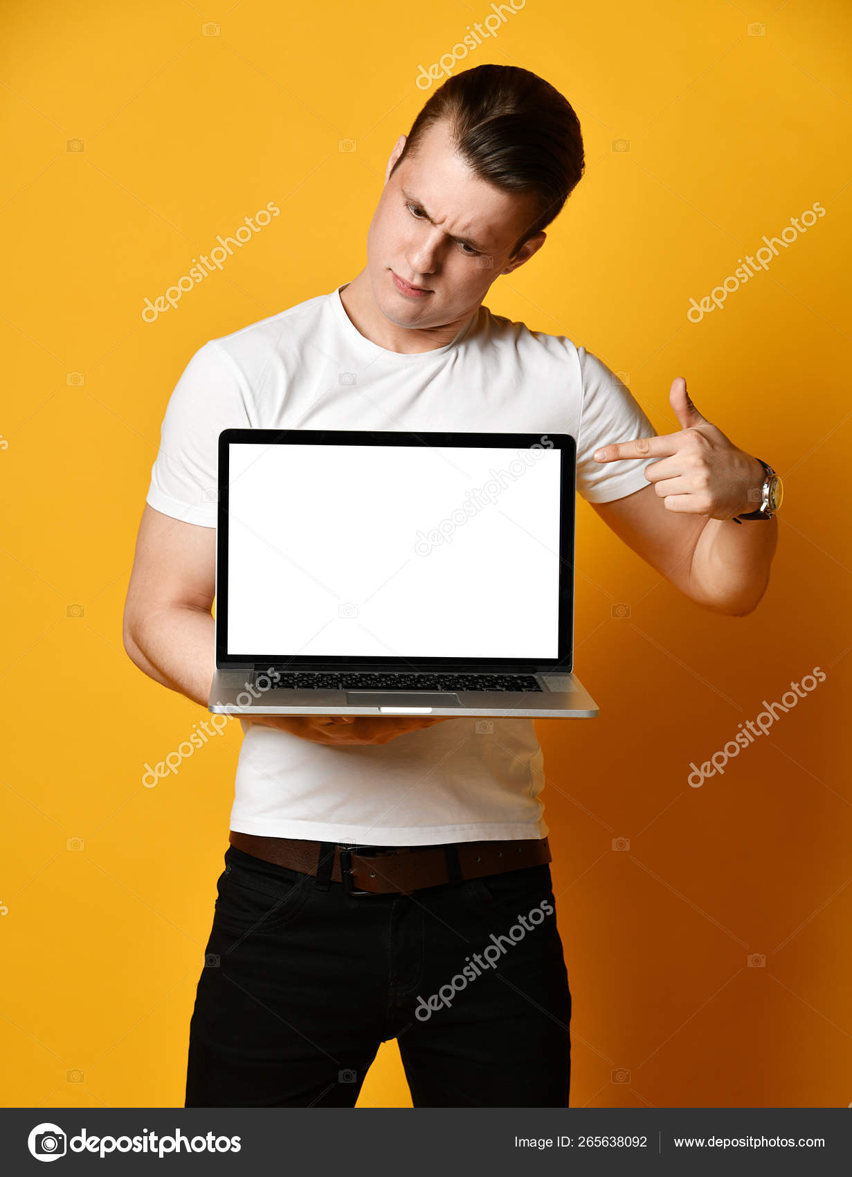 A handsome young man holding and showing the screen of a laptop — Stock ...