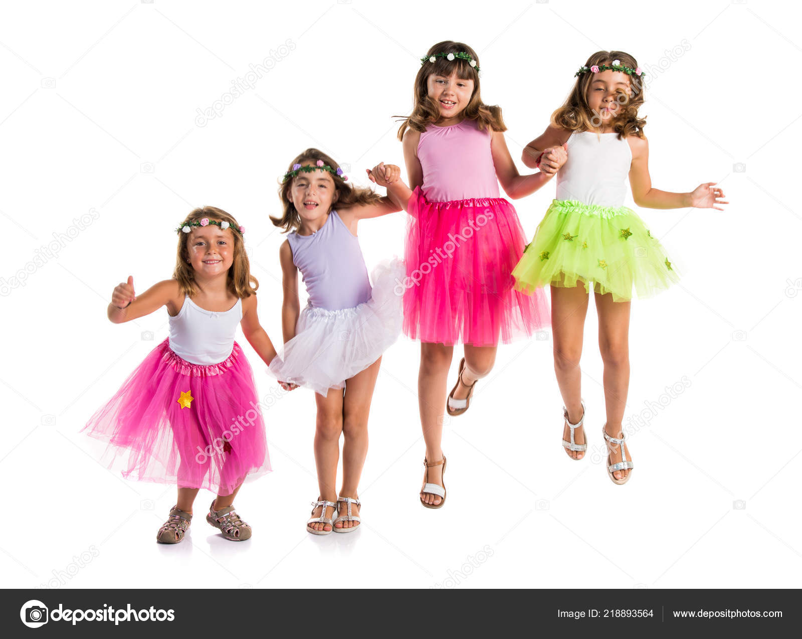 Cute Four Friends Playing Jumping Stock Photo by ©luismolinero 218893564