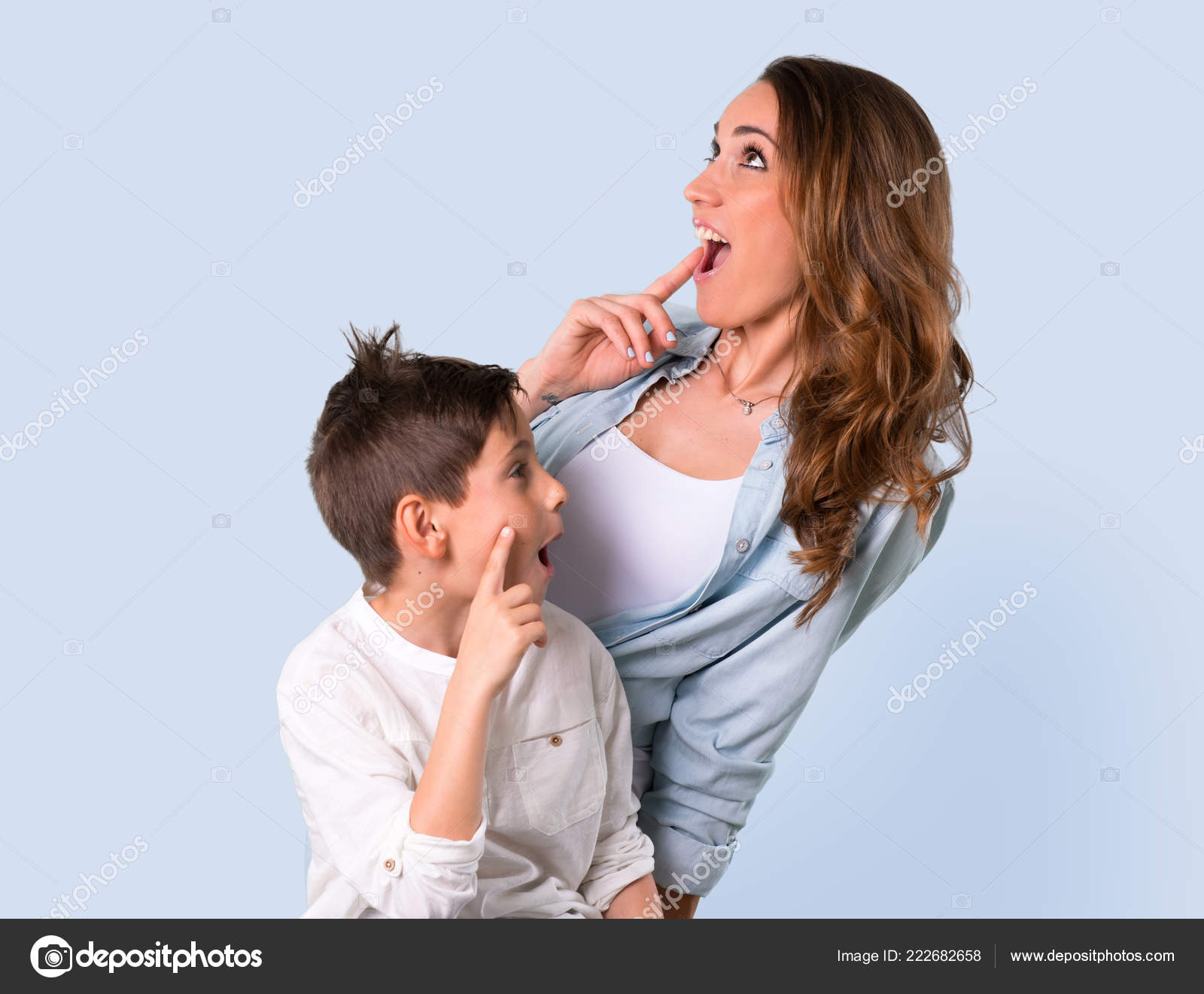 Mother Daughter Standing Thinking Idea Blue Background Stock Photo by ...