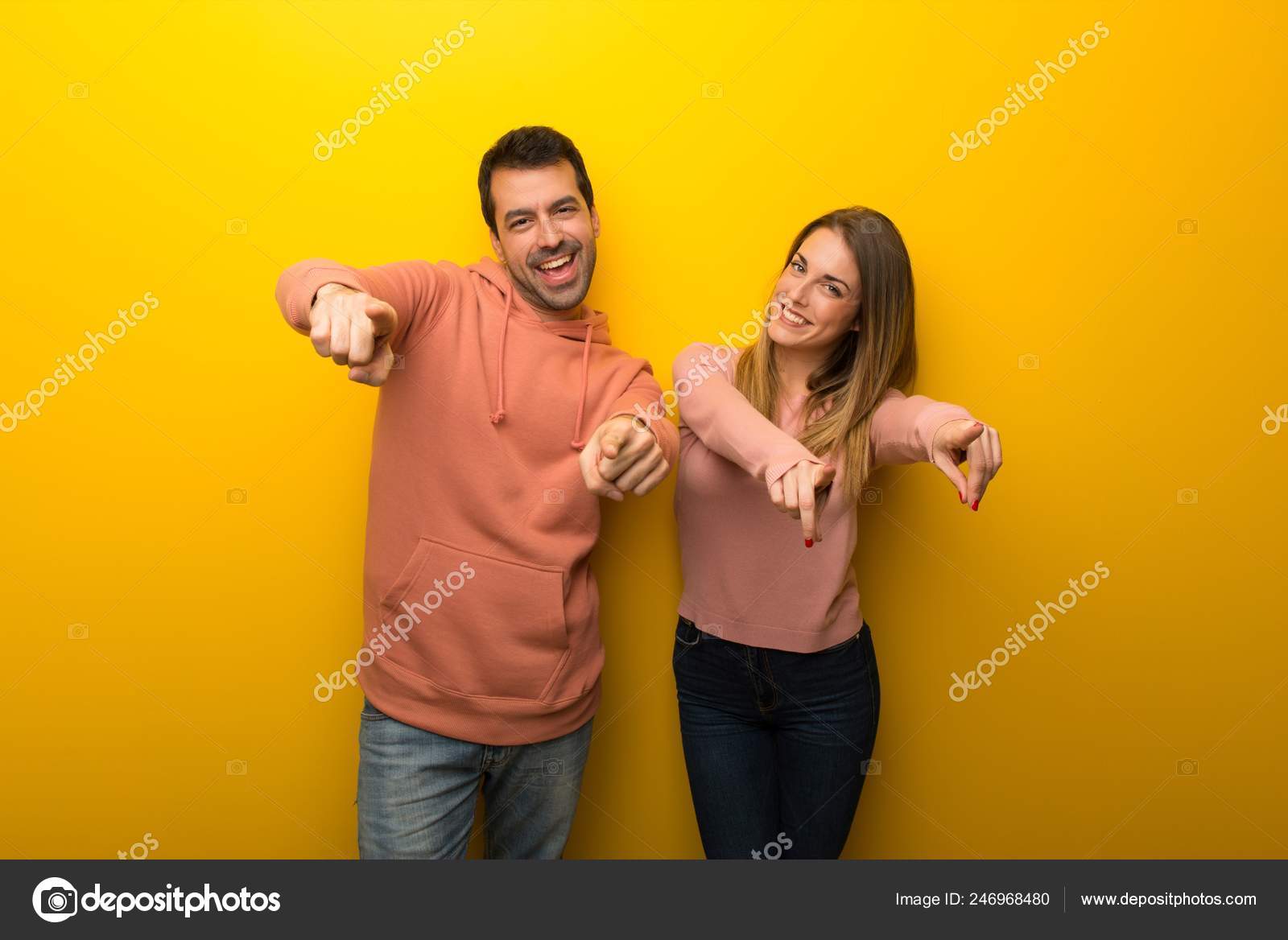 Group Two People Yellow Background Points Finger You While Smiling ...