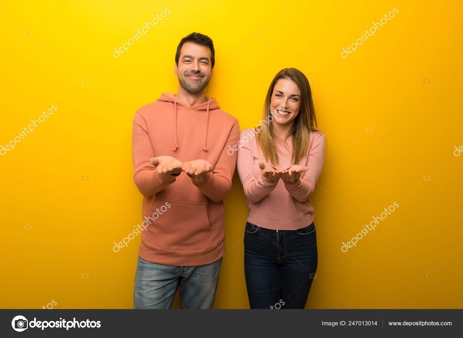 Group Two People Yellow Background Holding Copyspace Imaginary Palm ...