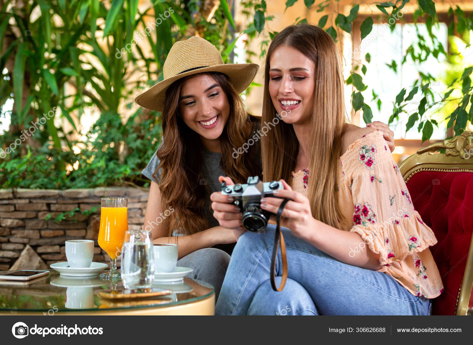 Two girls smiling looking at their camera — Stock Photo © didesign ...