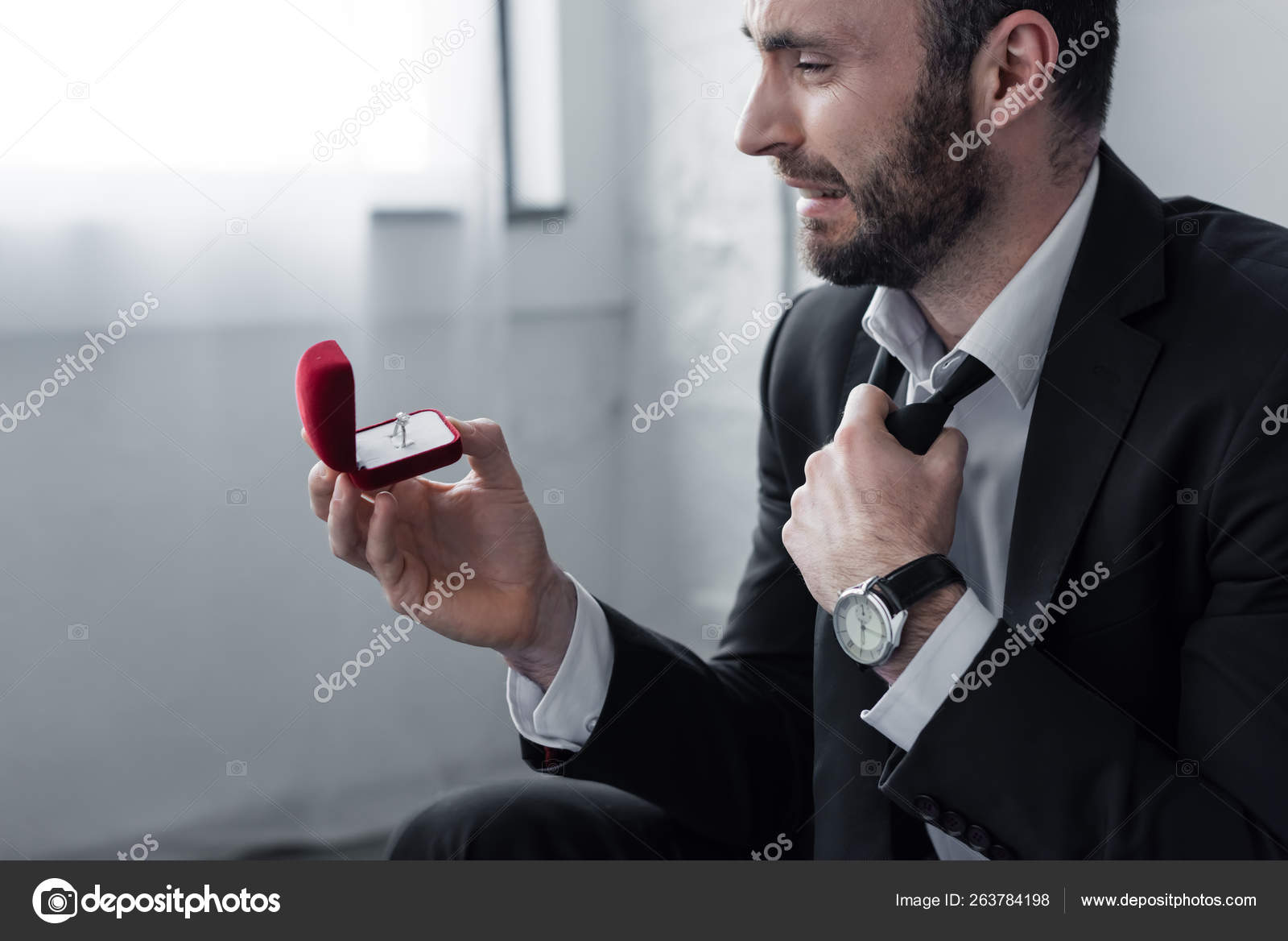 Depressed Bearded Man Crying While Looking Gift Box Ring — Stock Photo ...