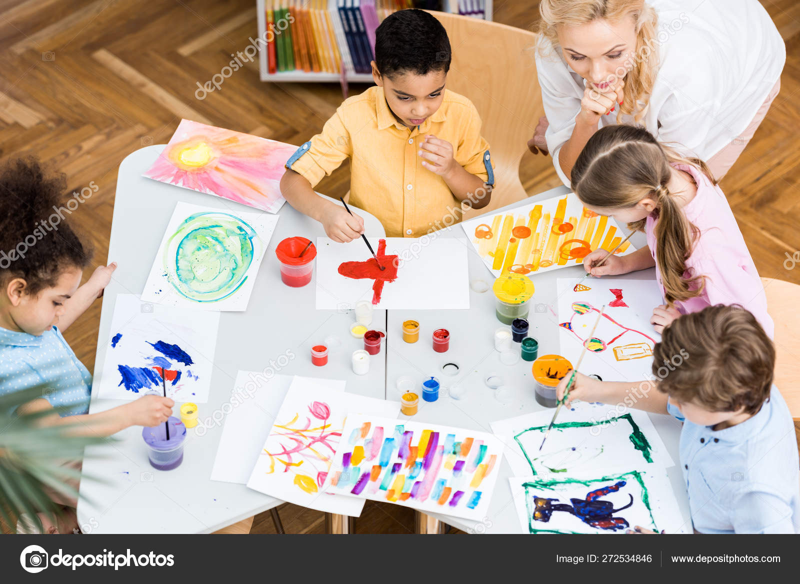 Overhead View Woman Looking Multicultural Kids Painting Papers — Stock ...