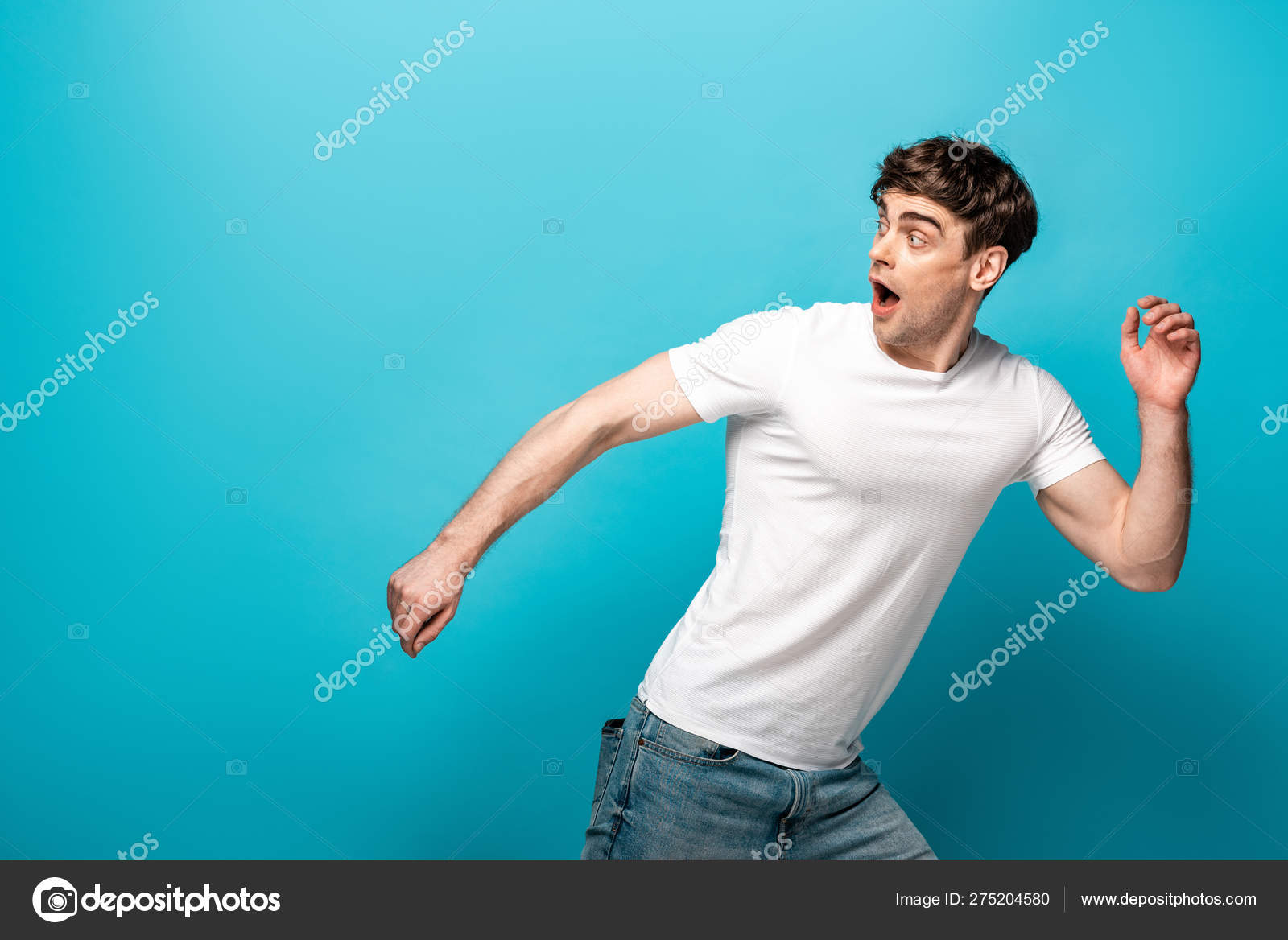 Scared Young Man Running Away Looking Back Blue Background Stock Photo ... Scared Young Man Running Away Looking Back Blue Background Stock Photo ...