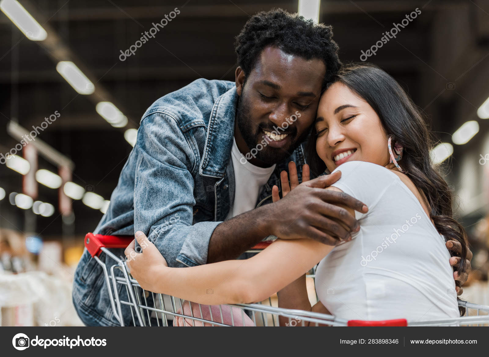 Happy African American Man Hugging Asian Pretty Woman Closed Eyes