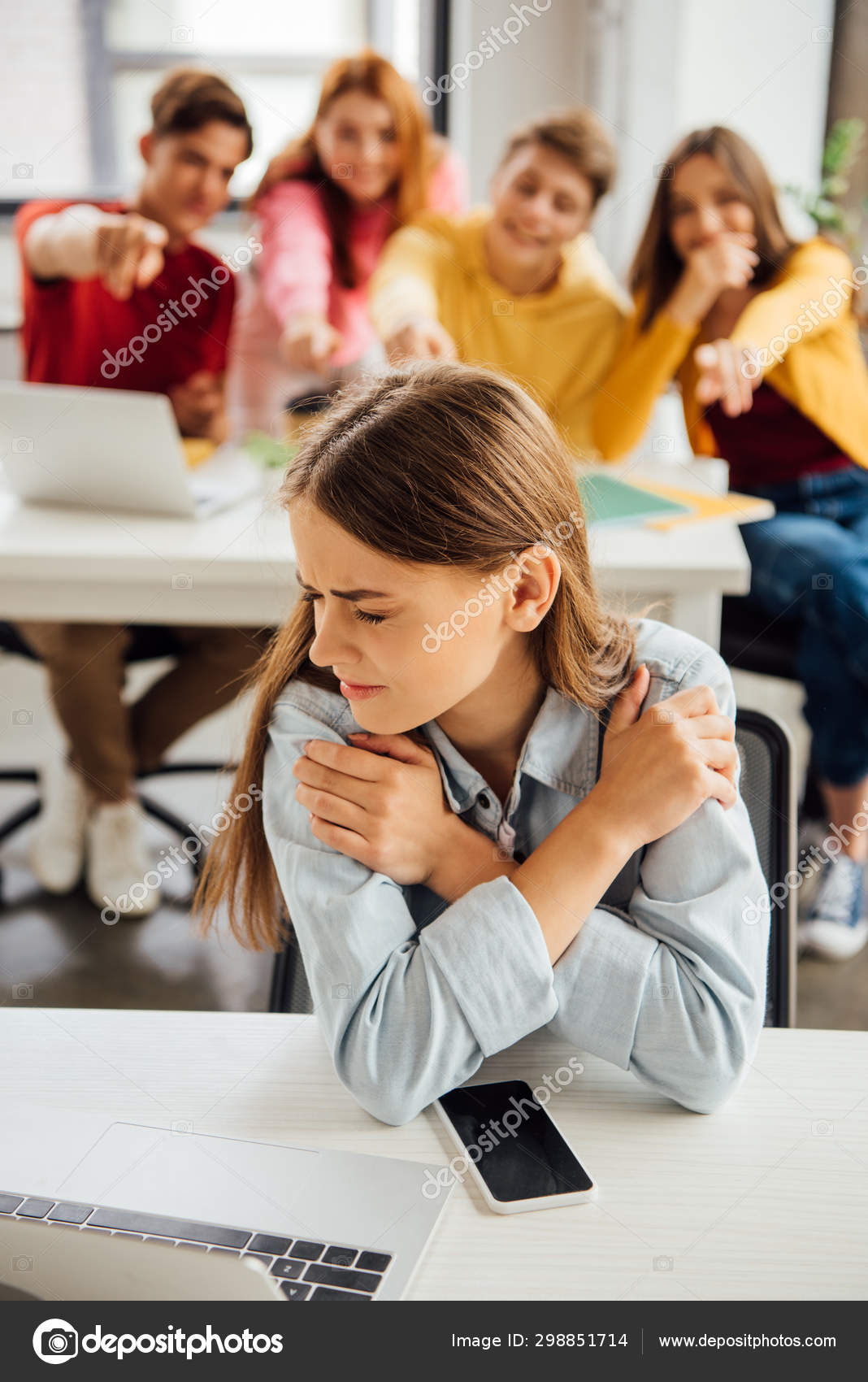 Schoolchildren Laughing While Bullying Sad Girl Foreground Stock Photo ...