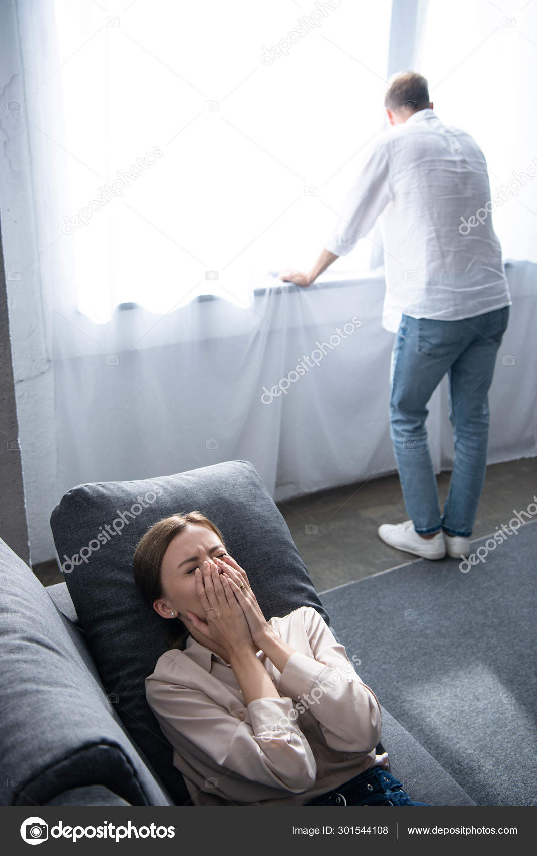 Upset Woman Crying Sofa Man Standing Window Stock Photo by ©HayDmitriy ...