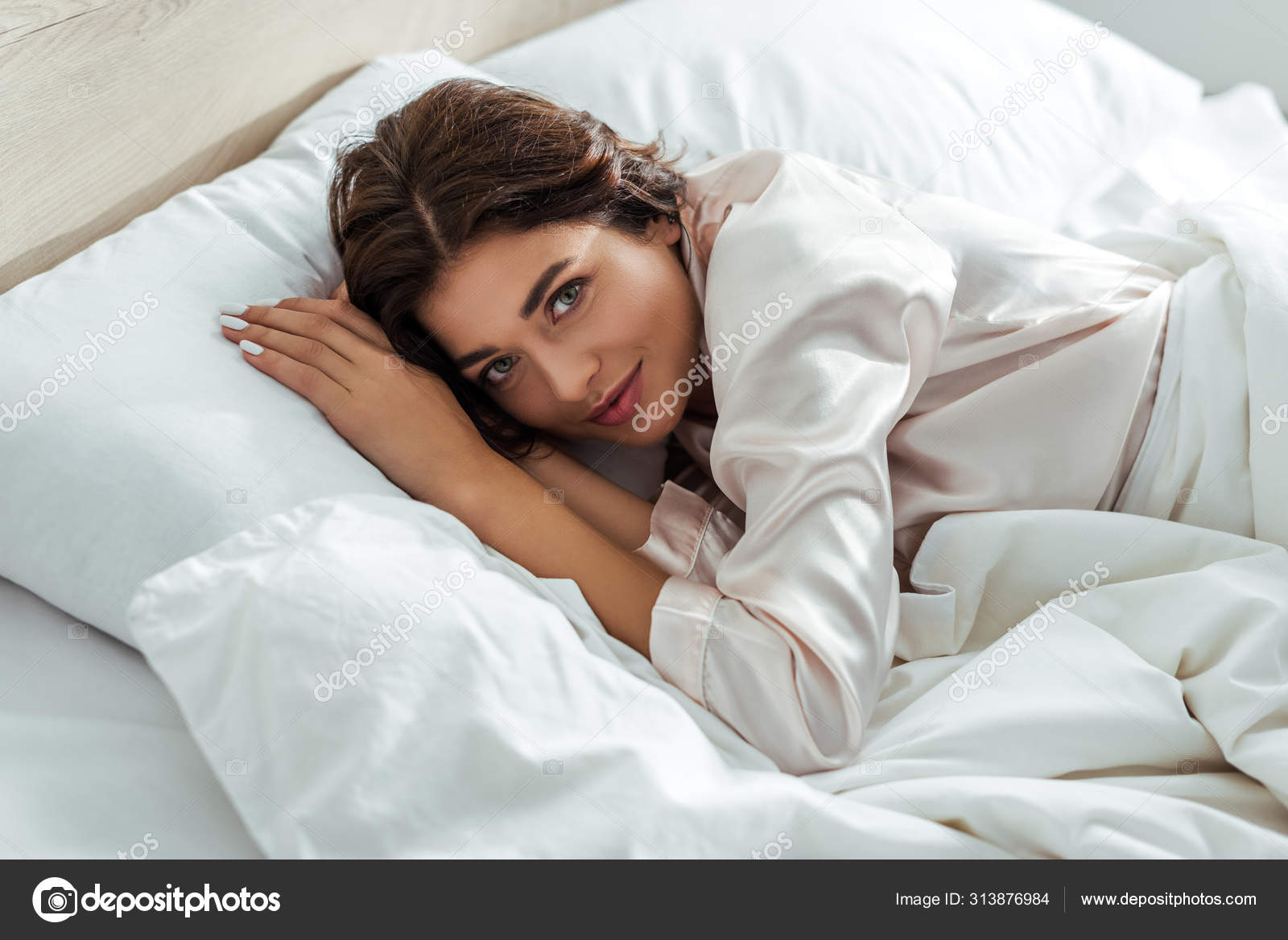 Woman Lying In Bed