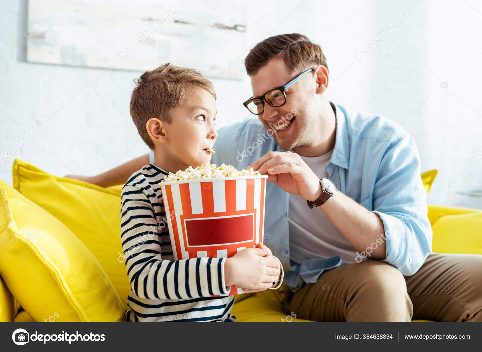 Happy Father Son Looking Each Other While Eating Popcorn Bucket — Stock ...