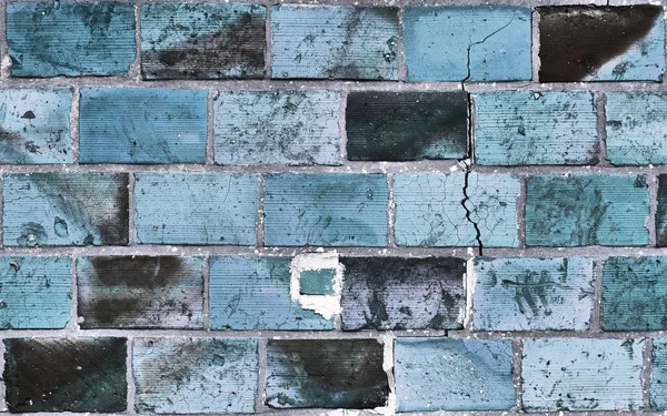 Detailed close up view on weathered blue brick walls at aged buildings ...