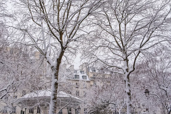 Paris under the snow, beautiful building facades in winter - Stock ...