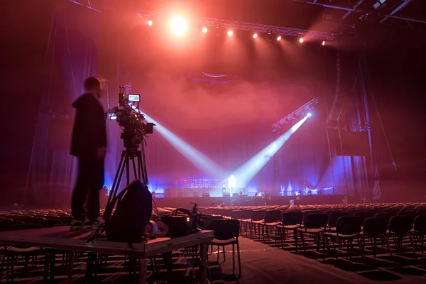 Professional digital video camera. cinematography in a concert hal ...