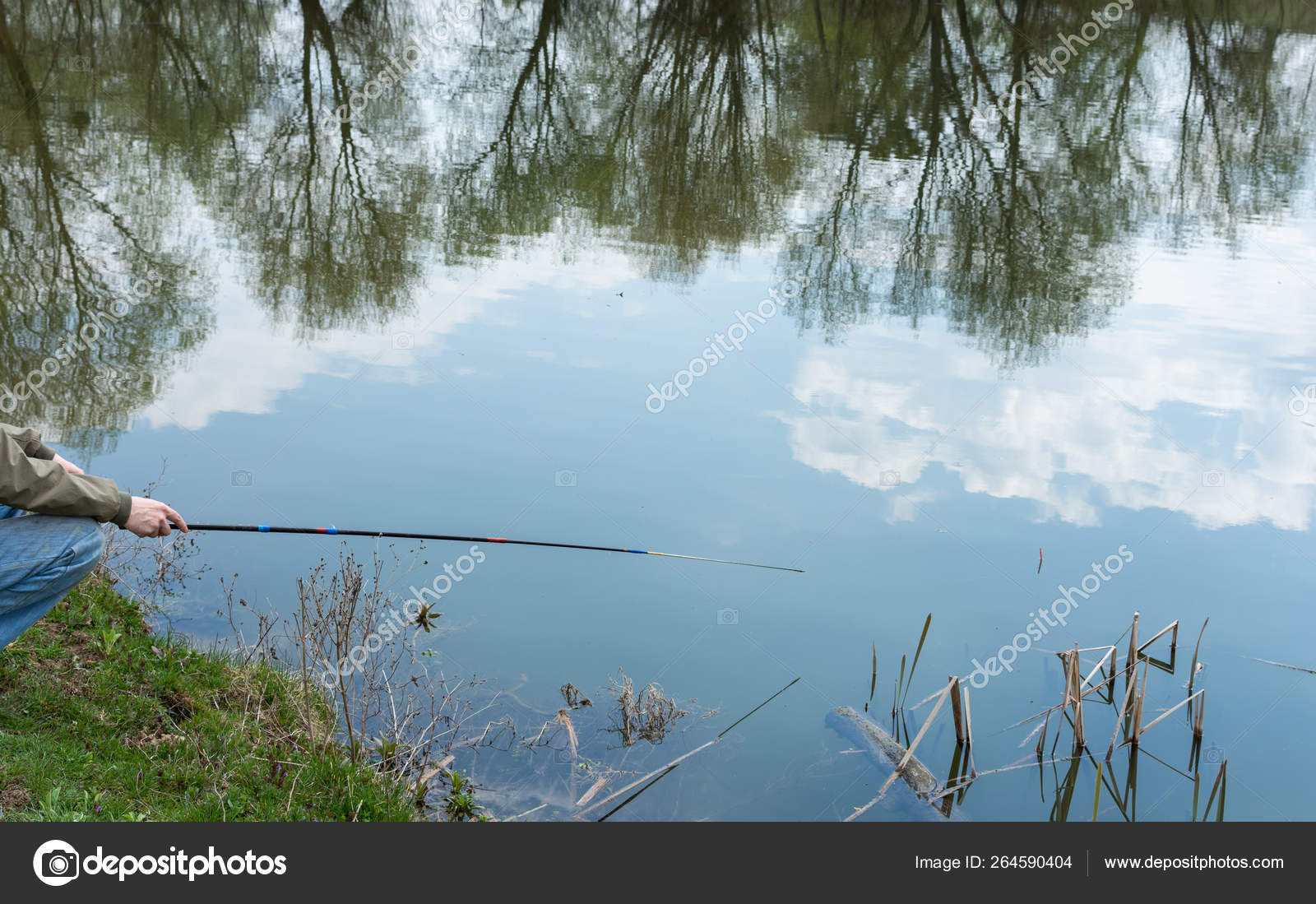 Fisherman catches fish — Stock Photo © pundapanda #264590404