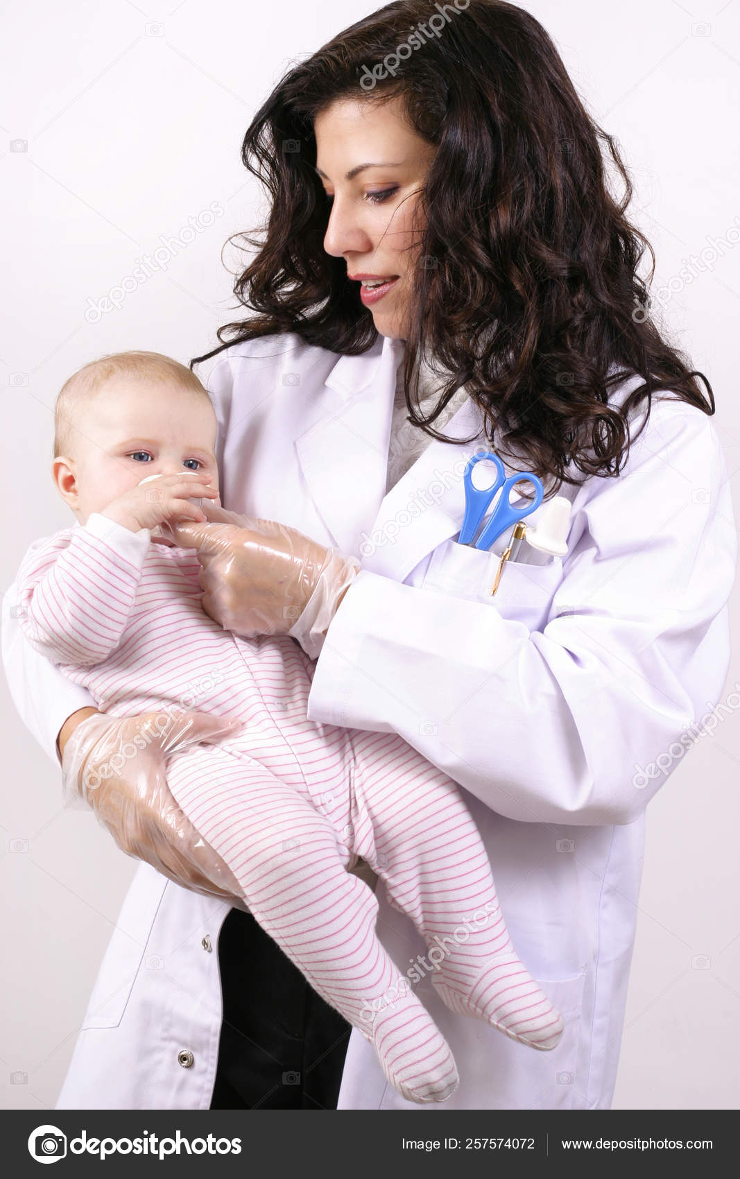 Doctor Medicating Baby Using Medicator Stock Photo by ©YAYImages 257574072