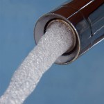 Bubbling Flowing Water Tap Isolated Stock Photo by ©YAYImages 262926220