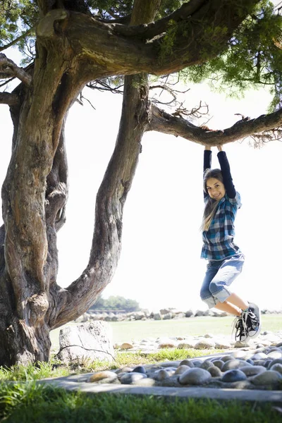 Portrait Smiling Tween Girl Standing Tree Stock Photo by ©YAYImages ...