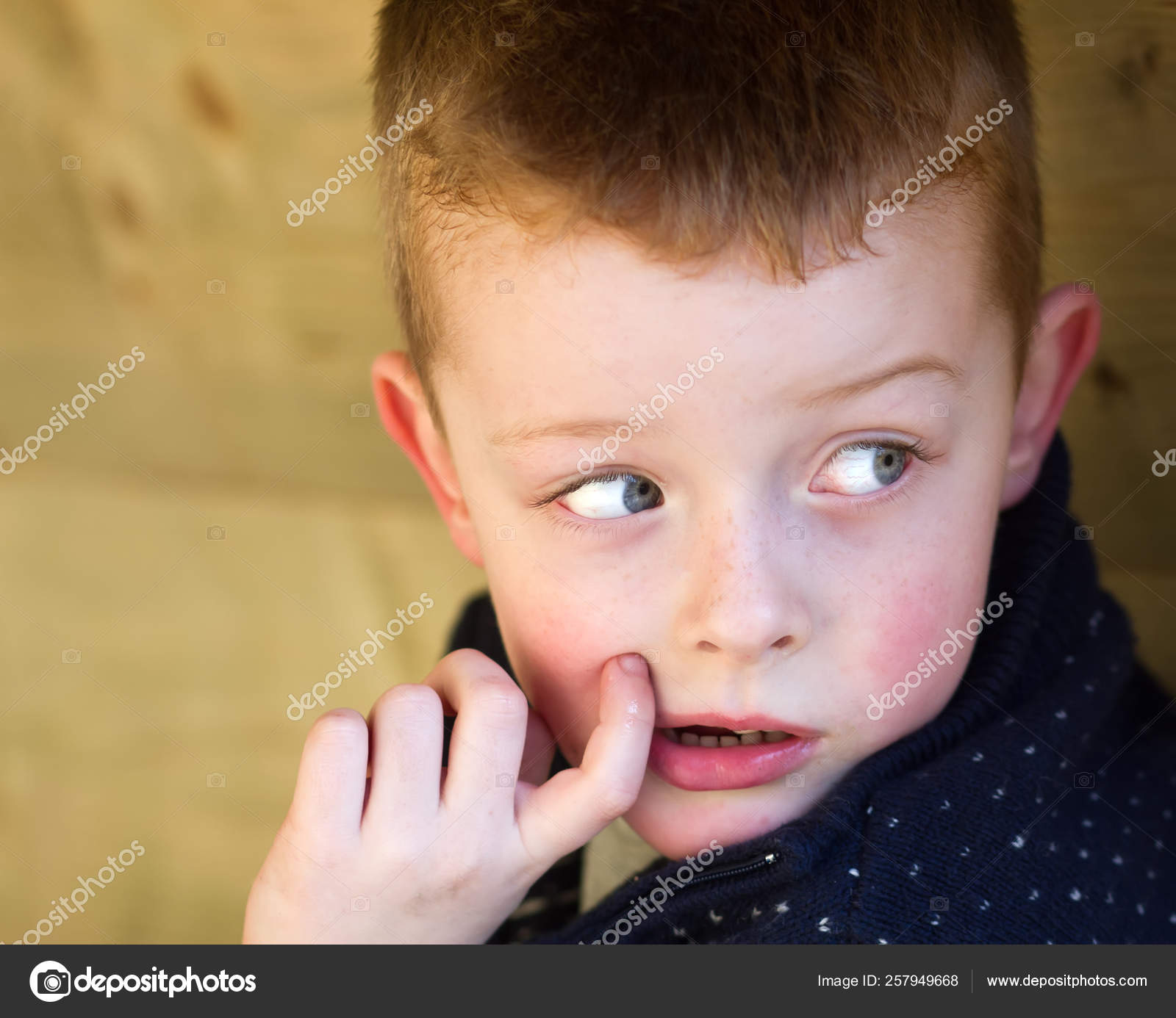 Young Boy Peeping Corner Stock Photo by ©YAYImages 257949668