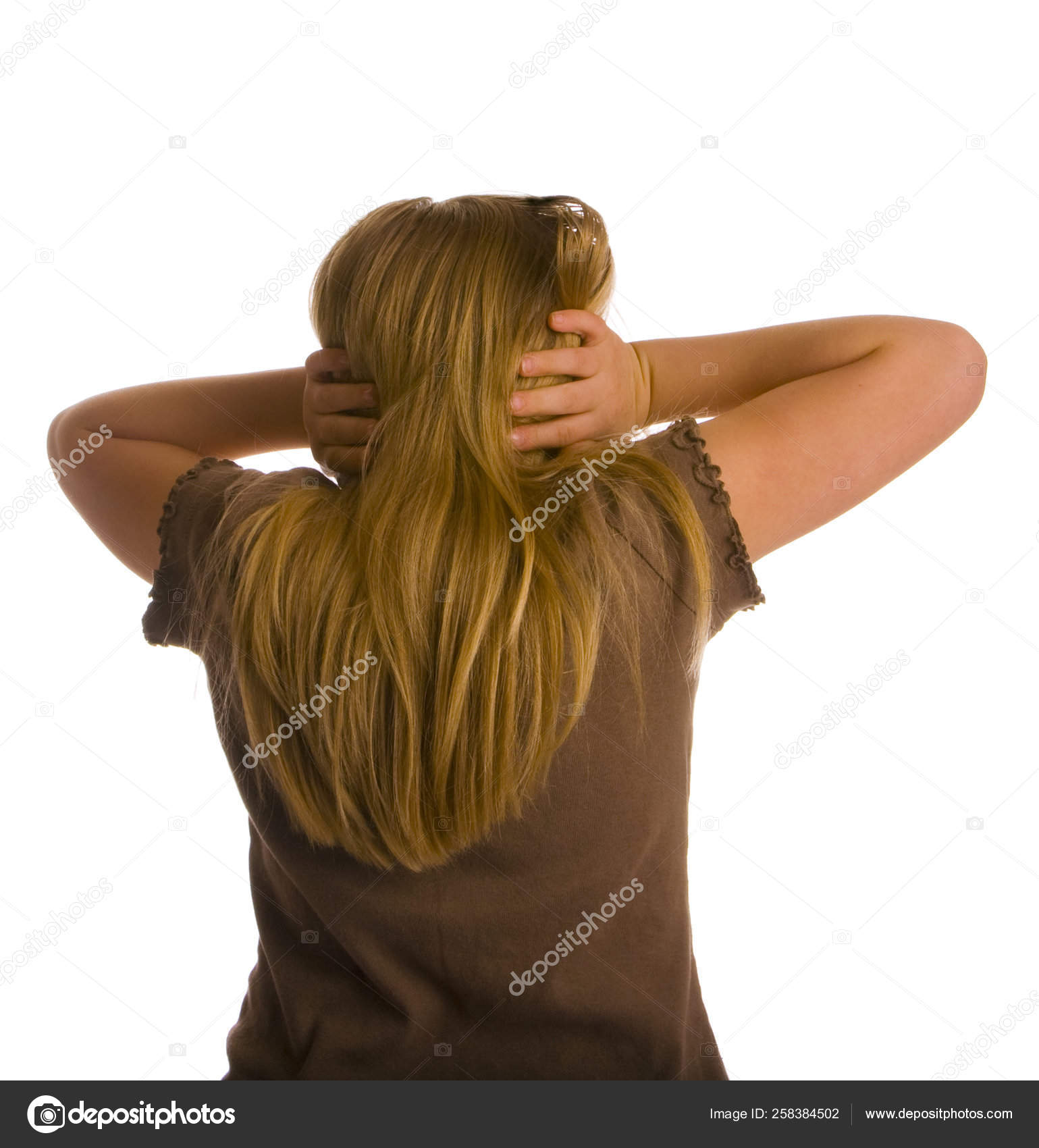 Girl Her Back Turned Ears Covered Stock Photo by ©YAYImages 258384502