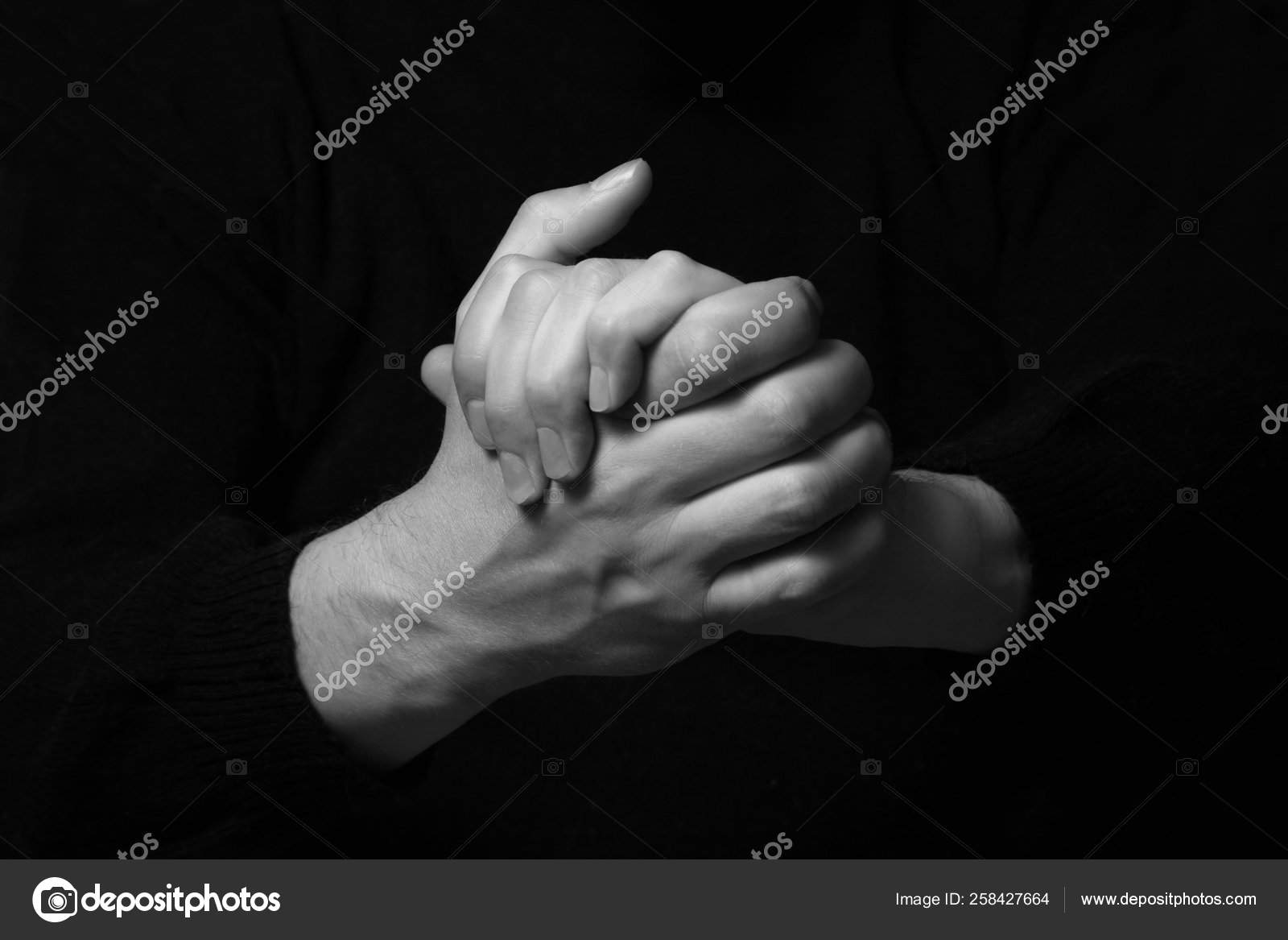 Two Man's Hands Dark Background Stock Photo by ©YAYImages 258427664