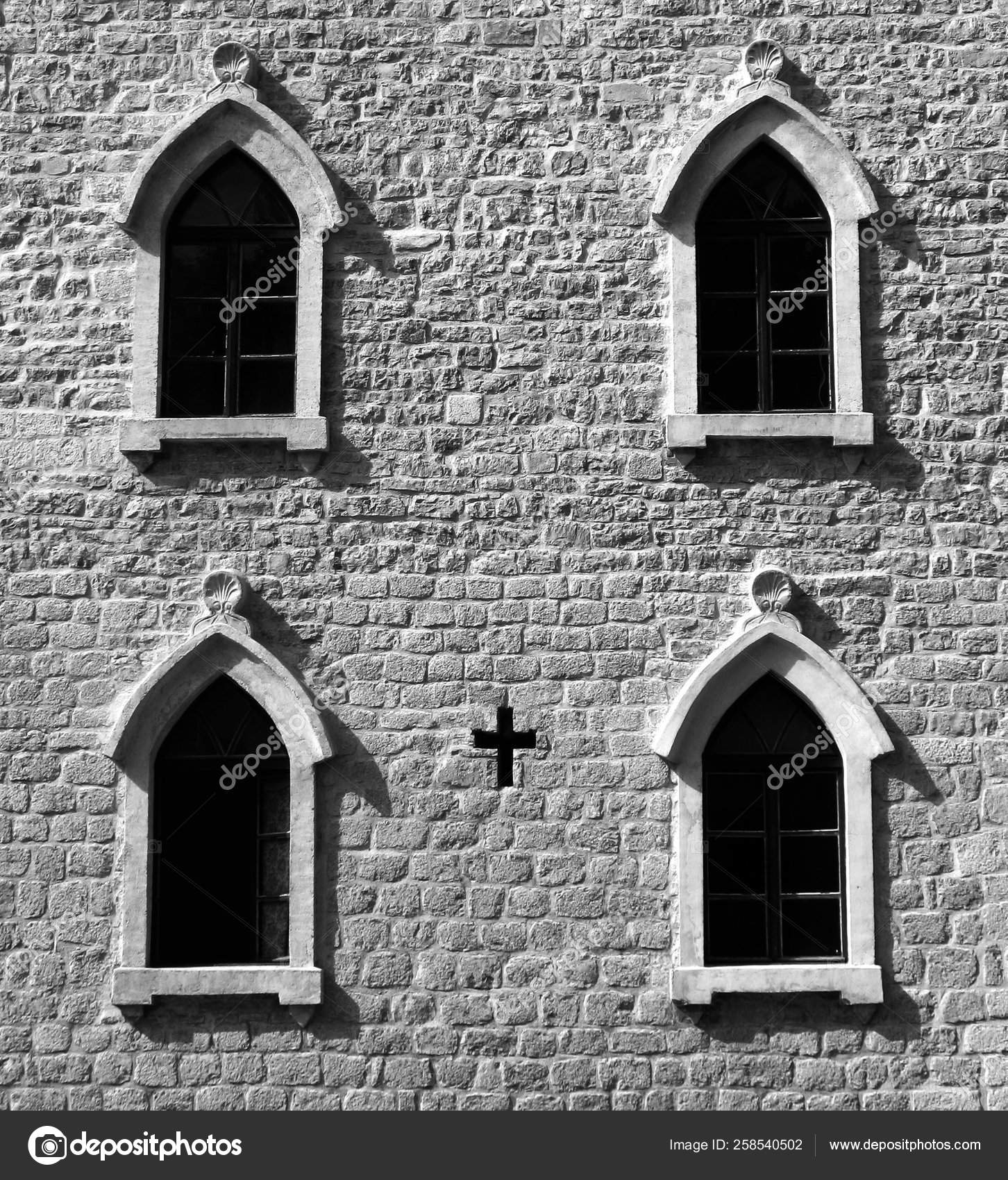 Brick Wall Gothic Windows Cross Image Stock Photo by ©YAYImages 258540502