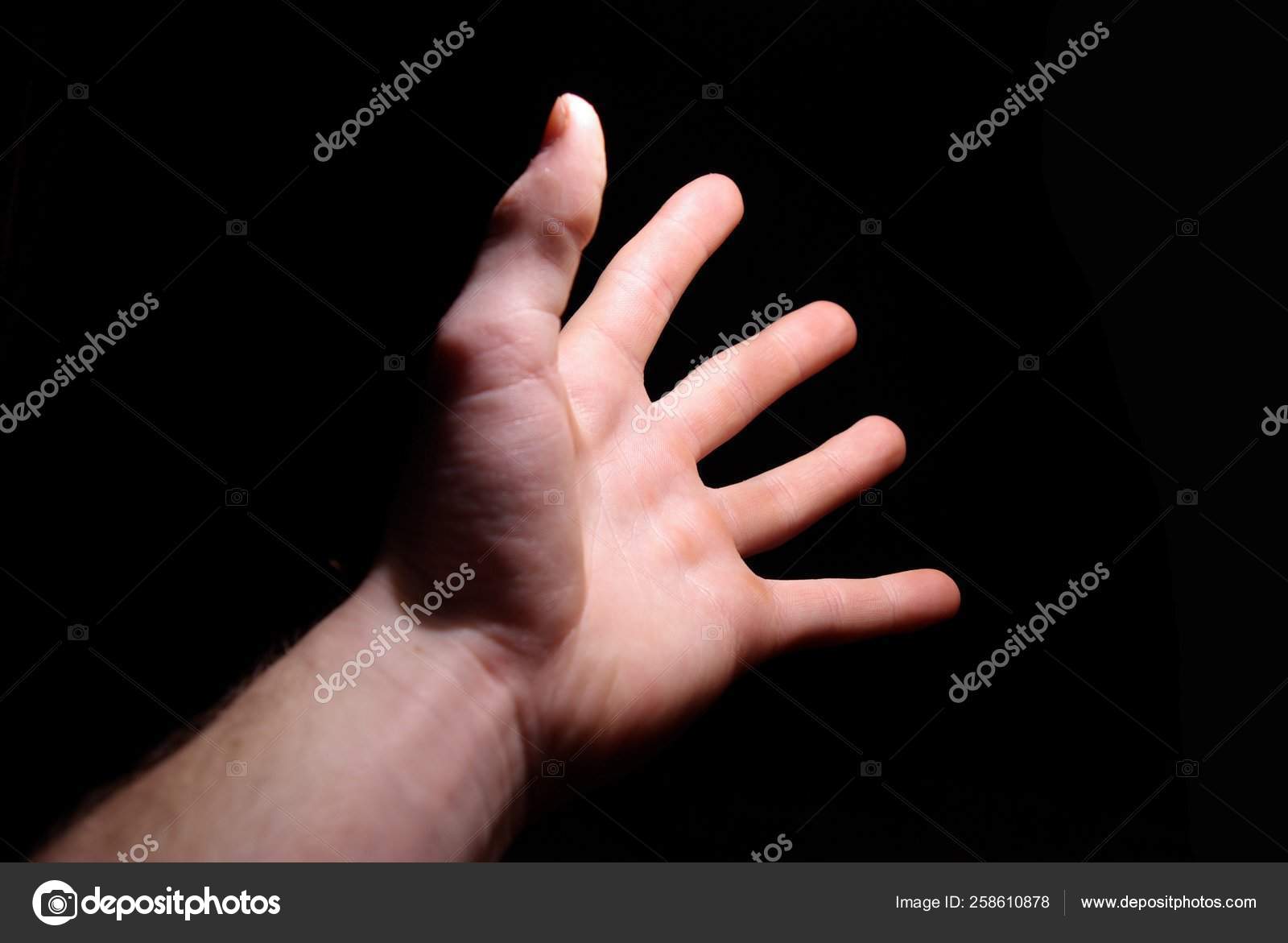 Extended Hand Help Black Background — Stock Photo © YAYImages #258610878