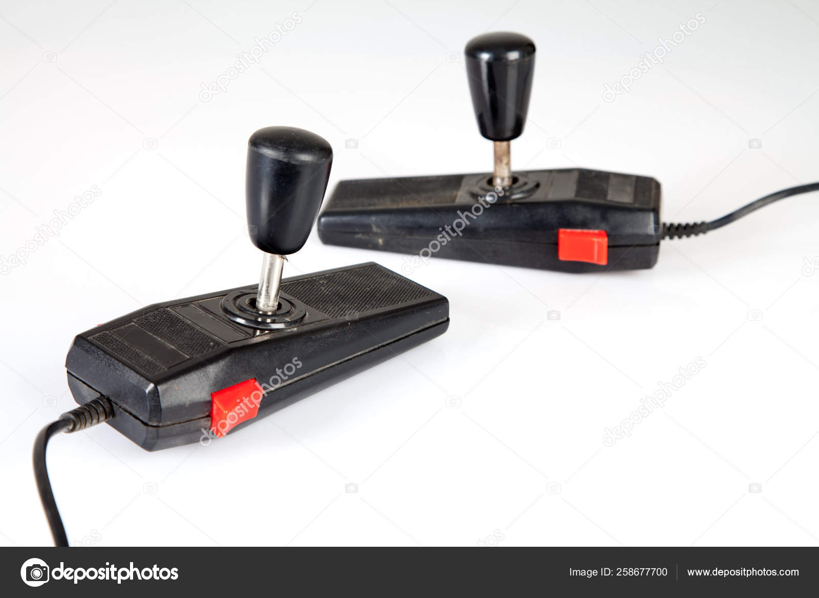 Retro Video Game Controllers — Stock Photo © YAYImages #258677700