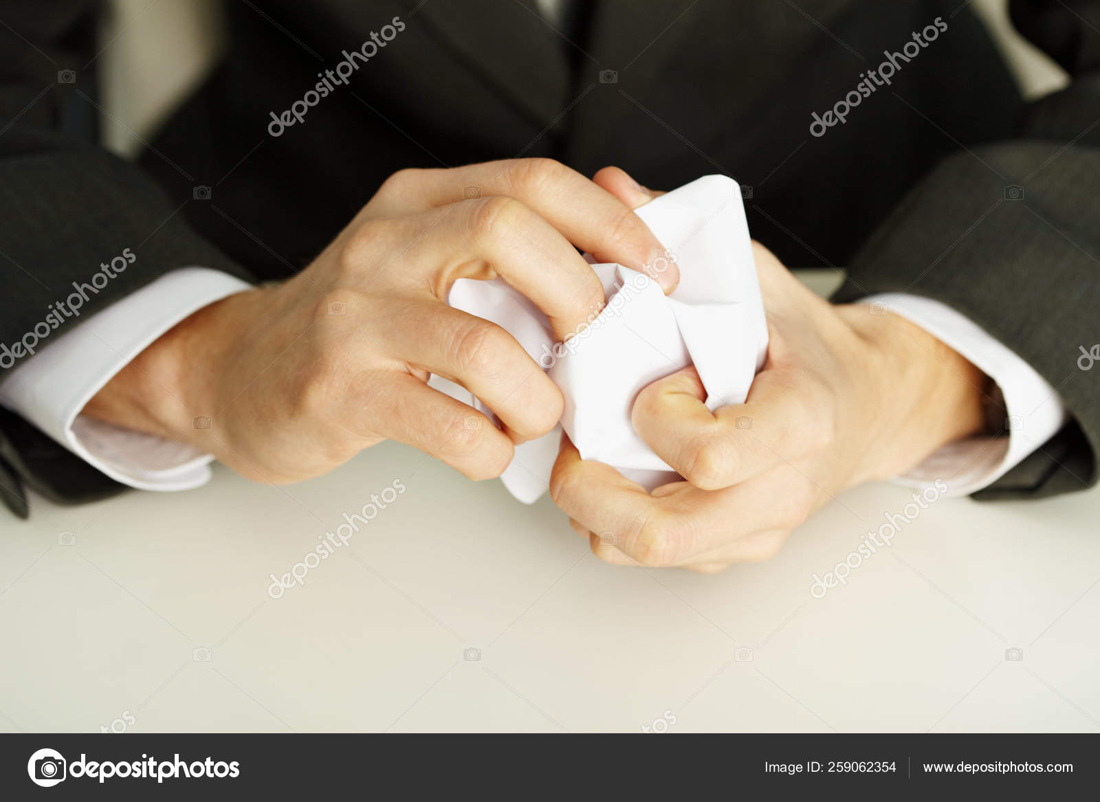Male Hands Crumpling Paper