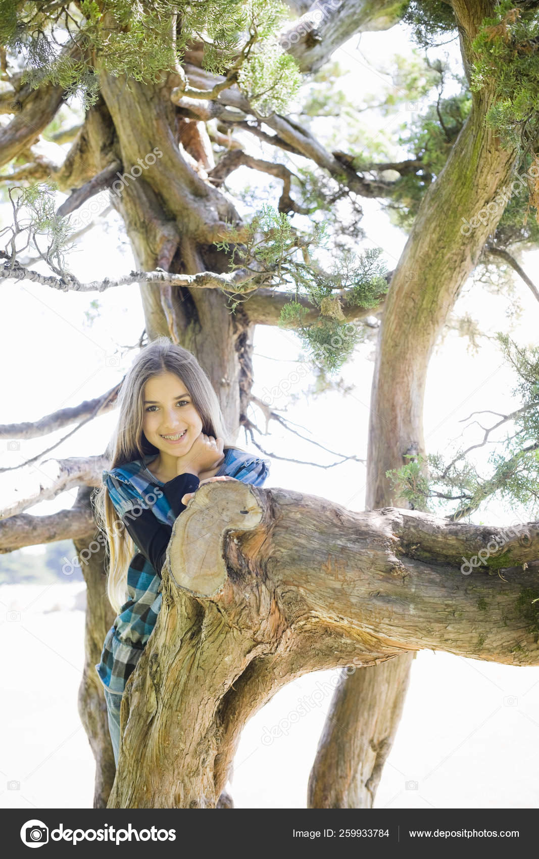 Portrait Smiling Tween Girl Standing Tree Stock Photo by ©YAYImages ...