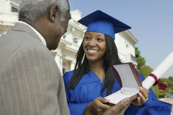 Graduate Student Receiving Gift From Father - Stock Image - Everypixel