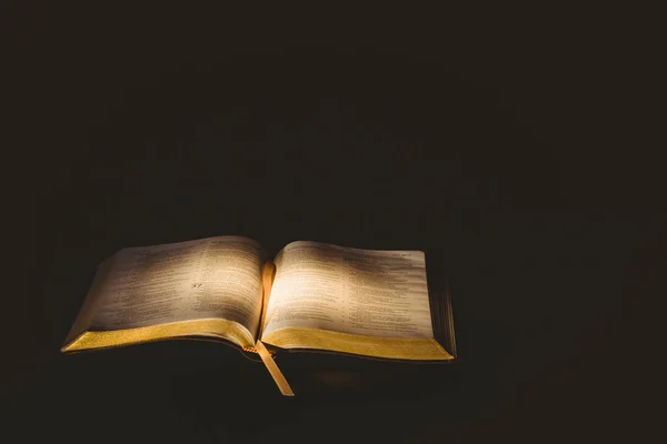 Light shining on open bible Stock Photo by ©Wavebreakmedia 68954403