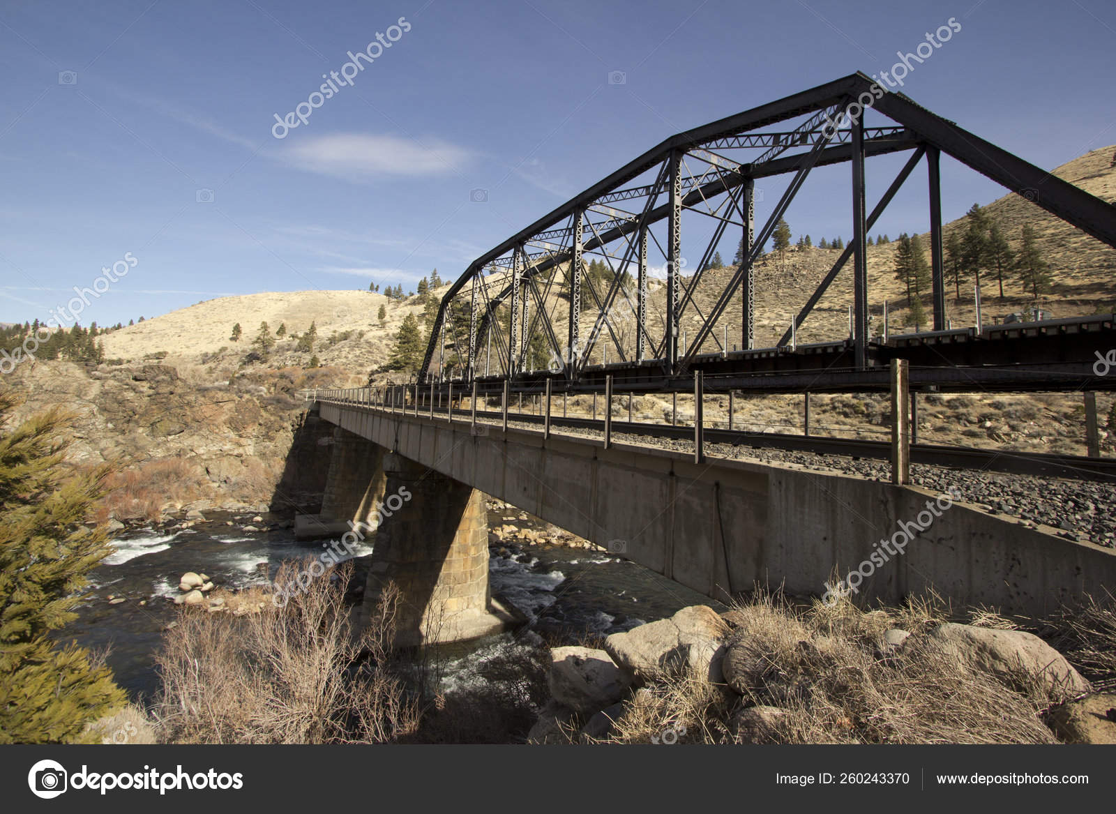 Train Bridge Fall Blue Skies River Stock Photo by ©YAYImages 260243370