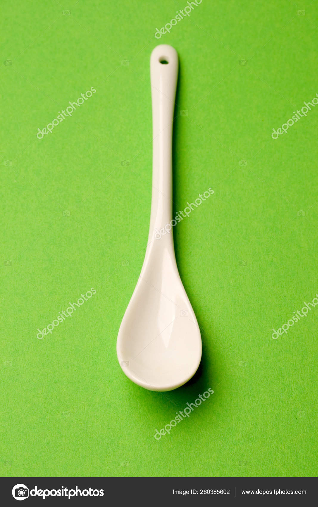 Spoon Isolated Green Background — Stock Photo © YAYImages #260385602