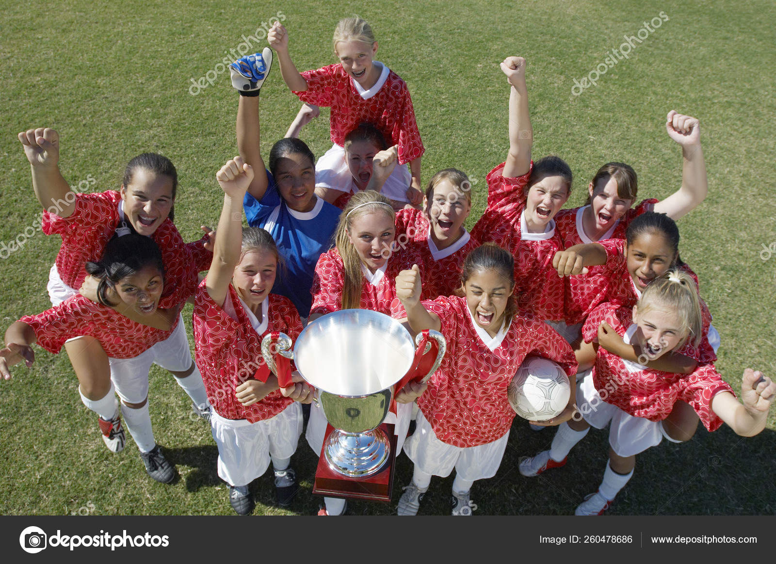Soccer Team Celebrating Victory Stock Photo by ©YAYImages 260478686