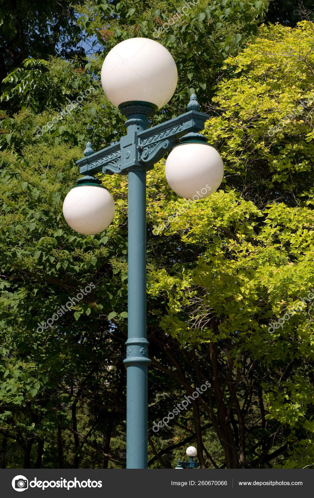 Lamp Post Three Lights Shot Green Tree Stock Photo by ©YAYImages 260670066