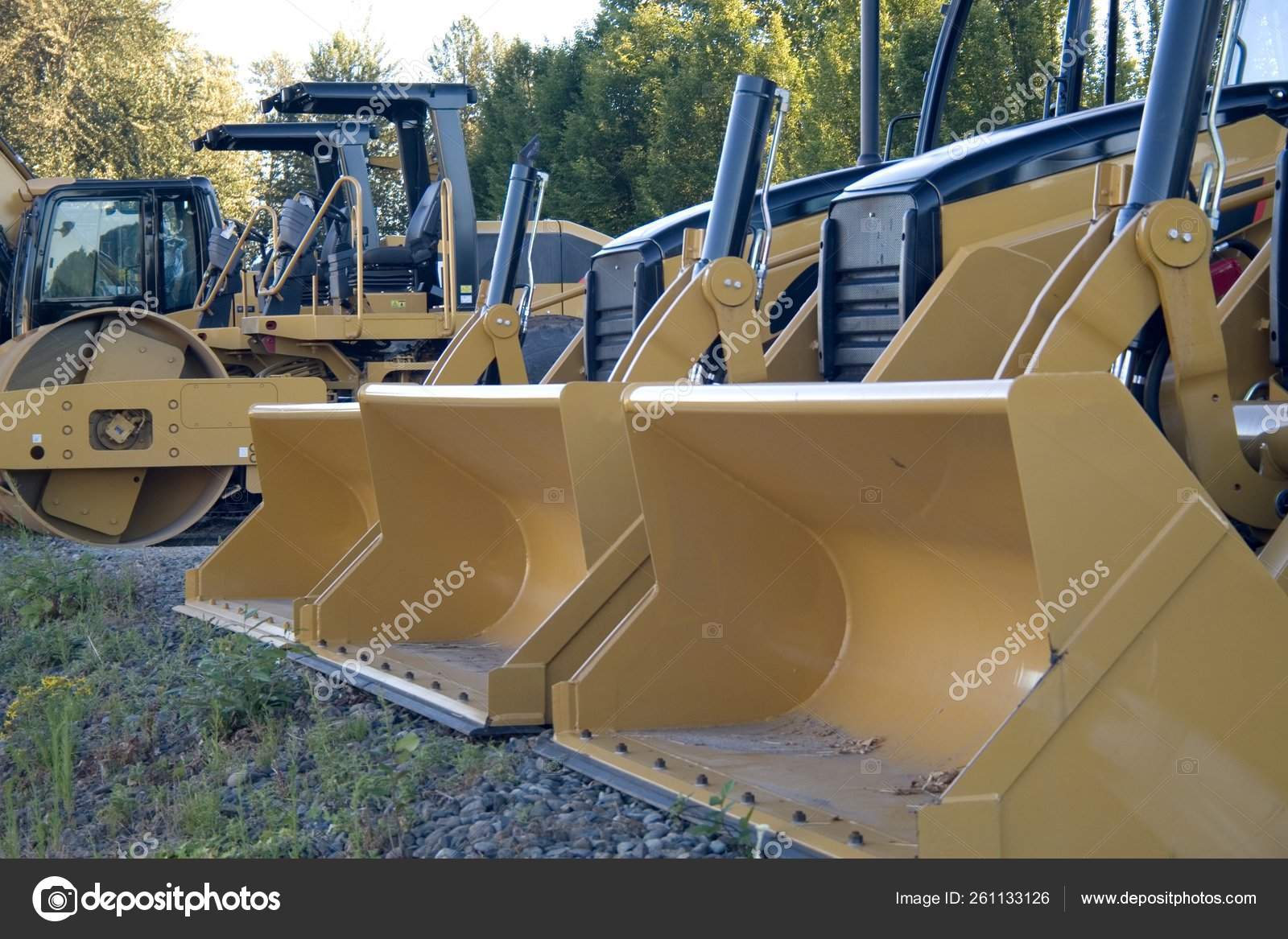 New Yellow Bulldozers Row Buckets Rollers — Stock Photo © YAYImages ...