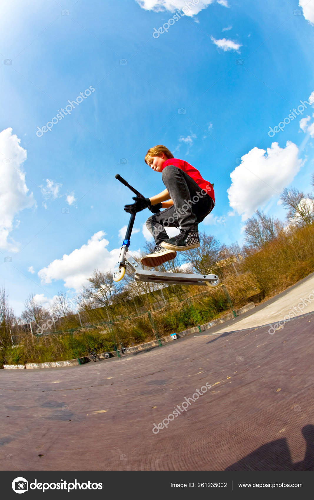 Boy Jumping Scooter Funbox Stock Photo by ©YAYImages 261235002